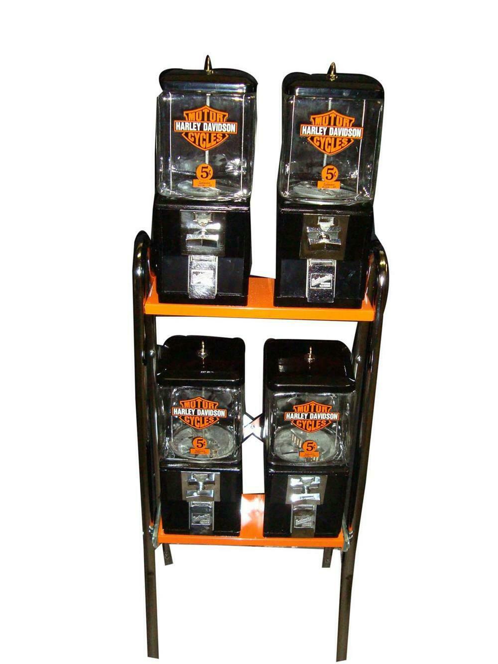 Lot of four 1960s coin-operated gumball/peanut machines on st