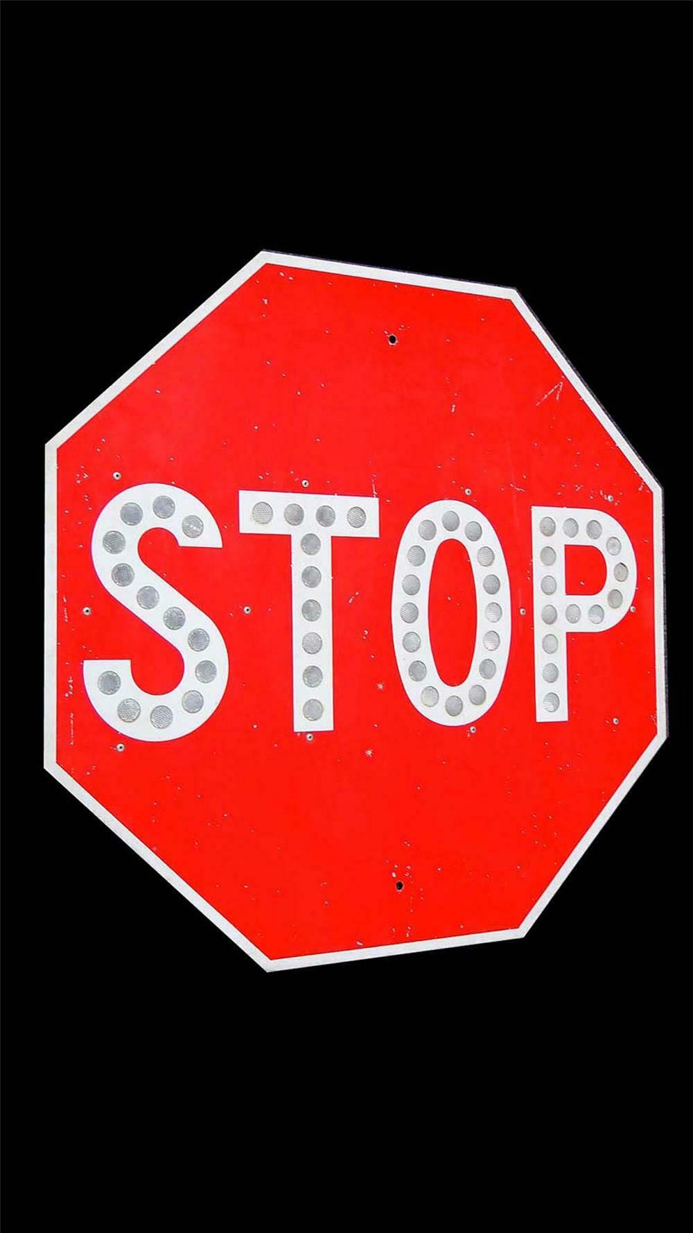Nifty 1950s metal Stop Sign with reflectors.