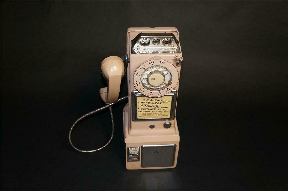Fun vintage service station coin operated pay phone.