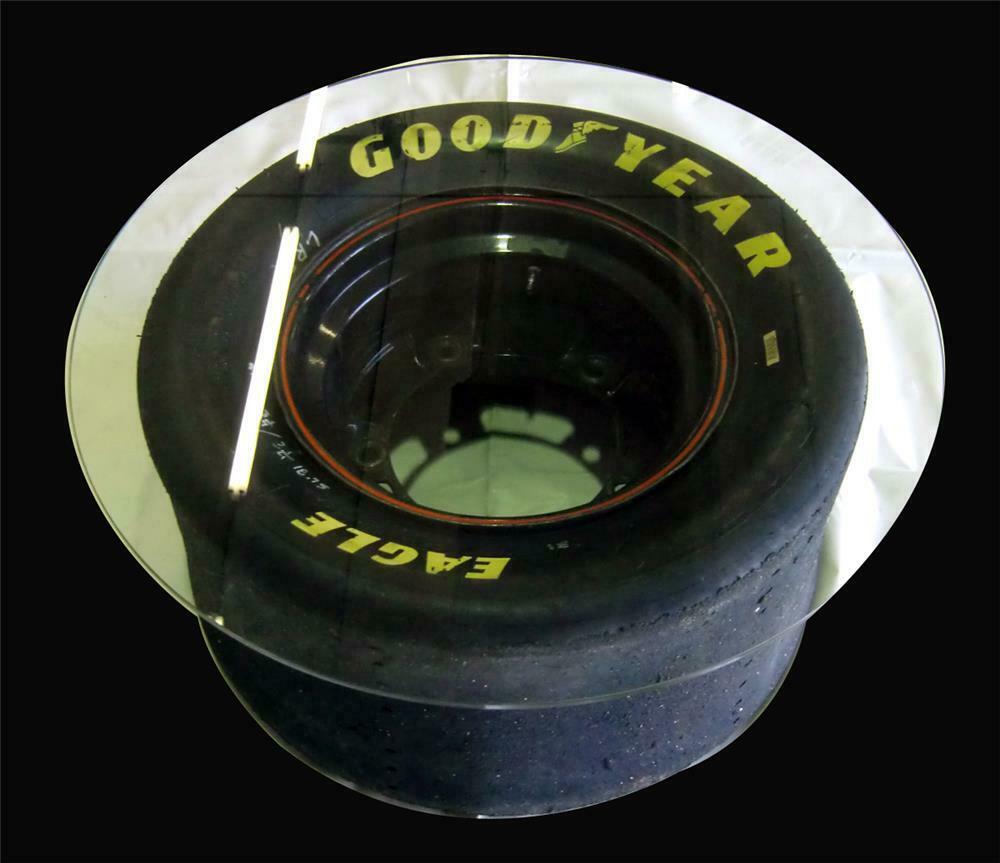 Darrell Gwynn's personal Nascar wheel and tire glass top tabl