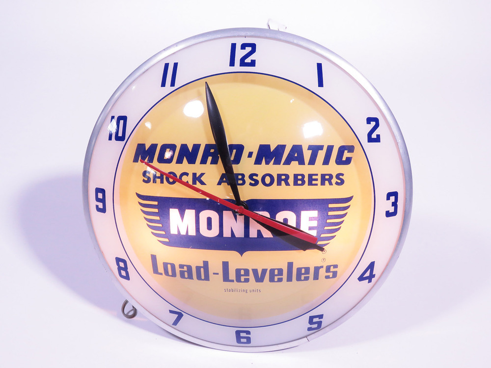EARLY 1960S MONROE SHOCK ABSORBERS LIGHT-UP CLOCK