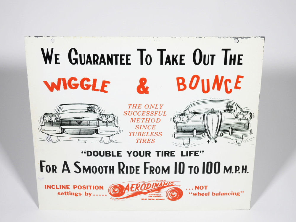 EARLY 1960S AERODYNAMIC WHEEL BALANCING TIN SIGN