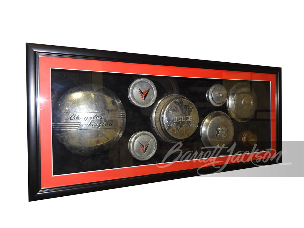 LARGE DISPLAY OF EARLY CHRYSLER-DODGE HUBCAPS