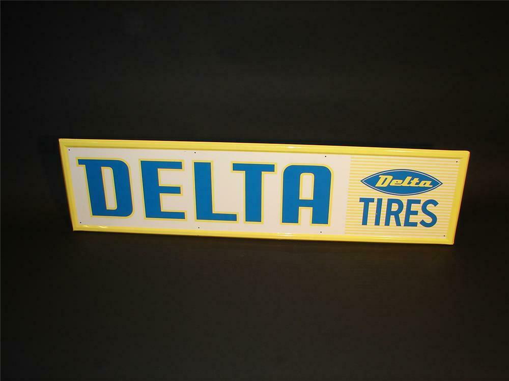 N.O.S. Delta Tires self-framed horizontal tin garage sign.
