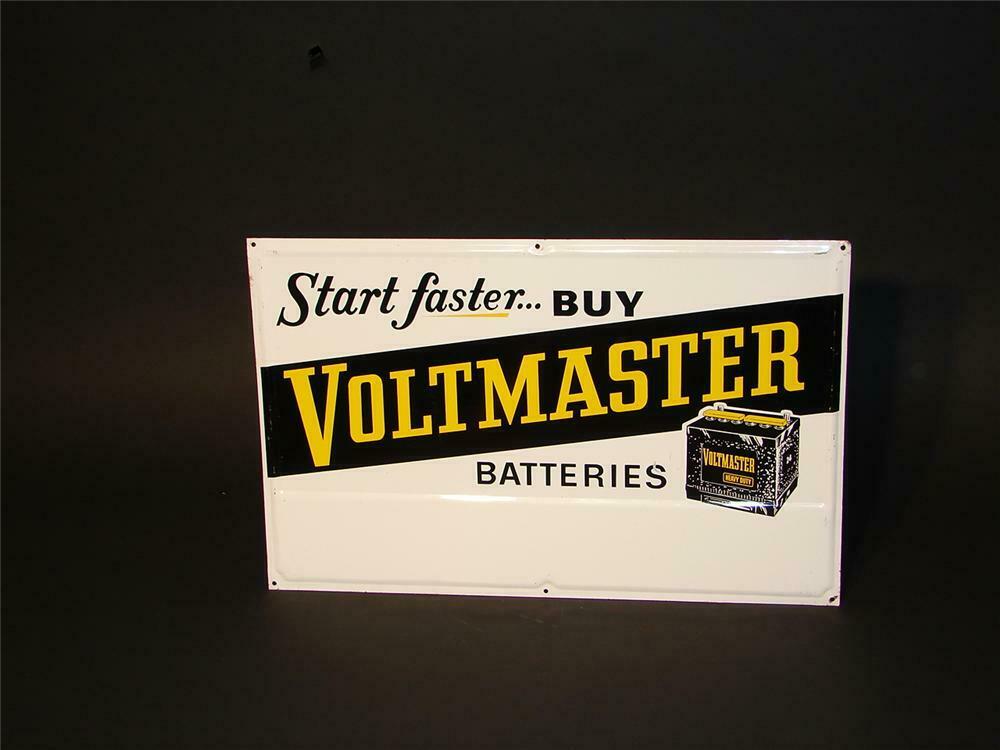 N.O.S. Voltmaster Batteries embossed tin garage sign.