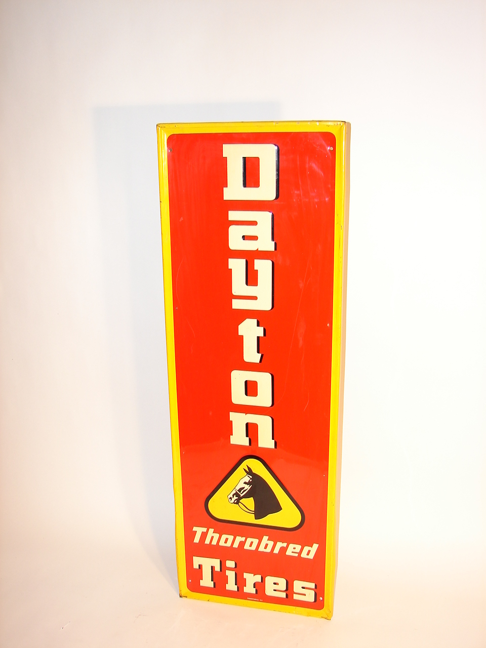 Dayton Tires tin painted vertical garage sign.