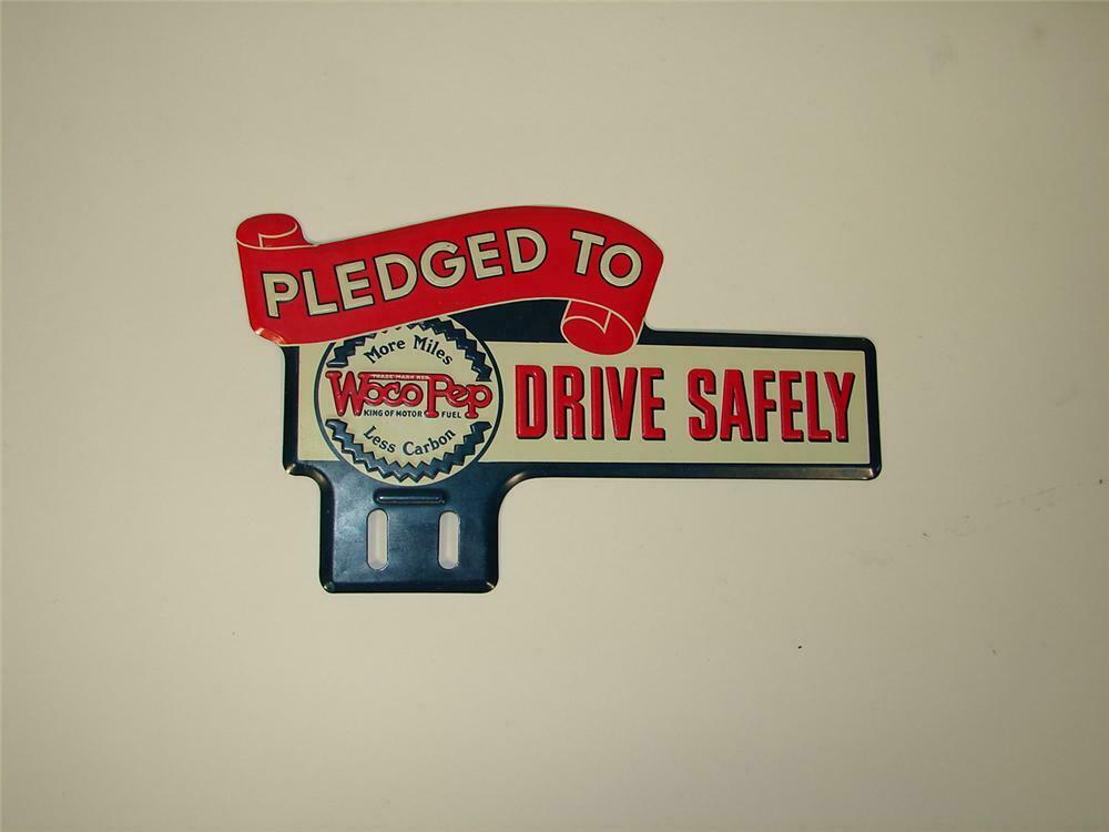 Woco Pep 'Drive Safely' license plate attachment sign.