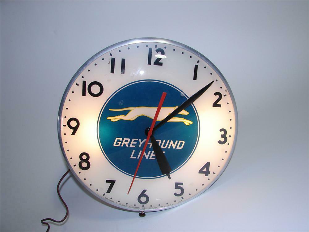 Rare Greyhound Bus Lines glass faced light-up depot clock.