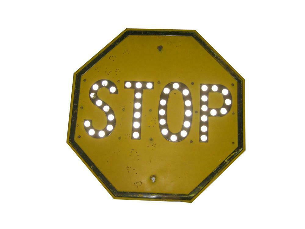 Vintage 1930s Highway Stop Sign with reflective cat-eyes.