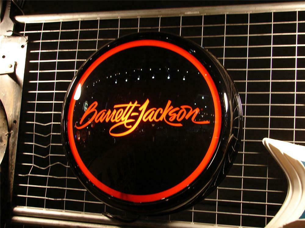 Stylish Barrett-Jackson glass faced light-up sign presented i
